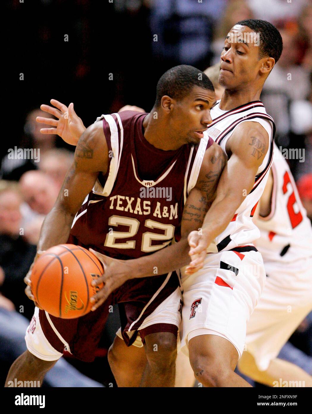 Texas Tech' John Roberson, right, defends against Texas A&M's Dominique ...