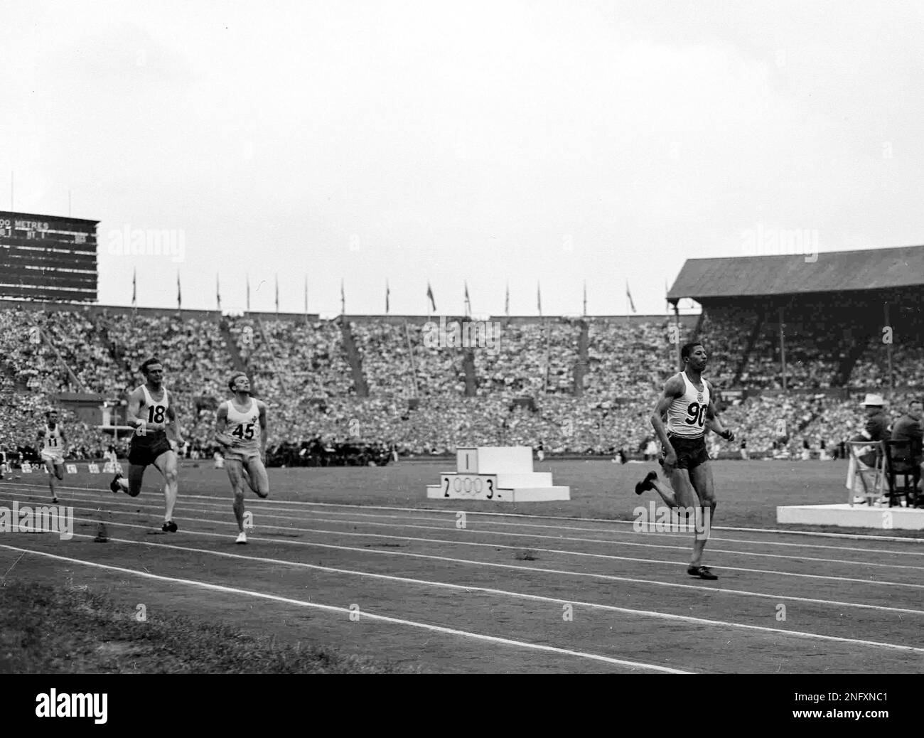Jamaica's Herbert McKenley, right, wins heat one of the men's Olympic ...