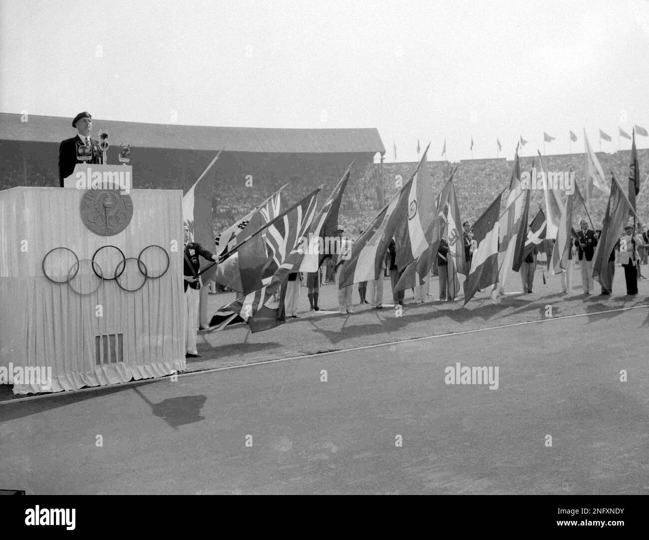 Britain's Wing Commander Donald Finlay, left on platform, takes the ...