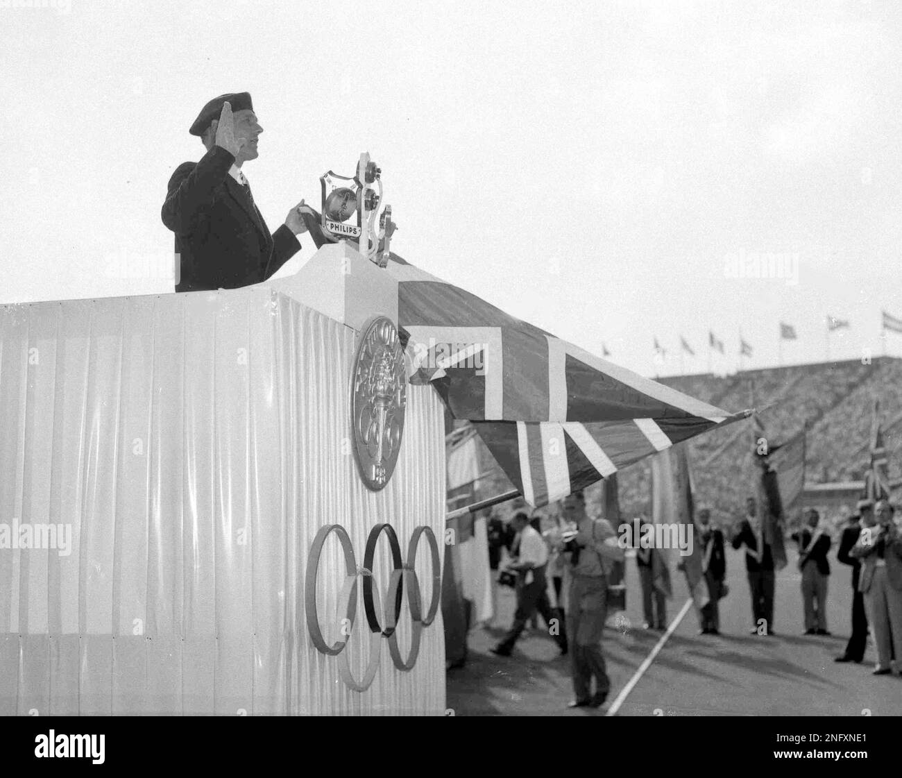 Britain's Wing Commander Donald Finlay, left on platform, takes the ...