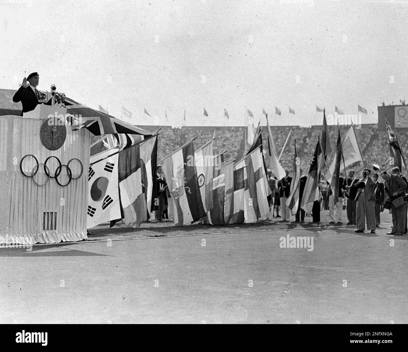 Britain's Wing Commander Donald Finlay, left on platform, takes the ...