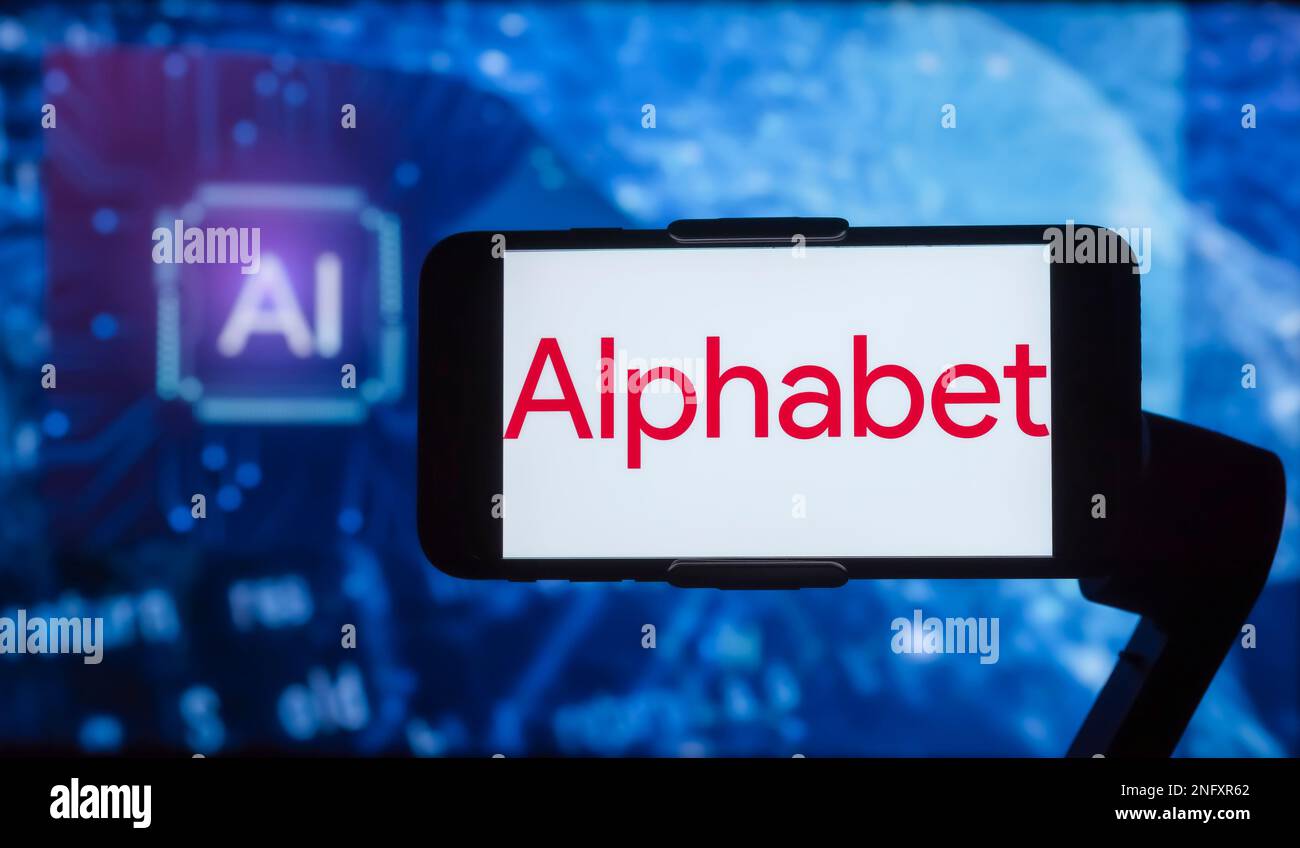 In this photo illustration, the logo of Alphabet is seen displayed on a ...