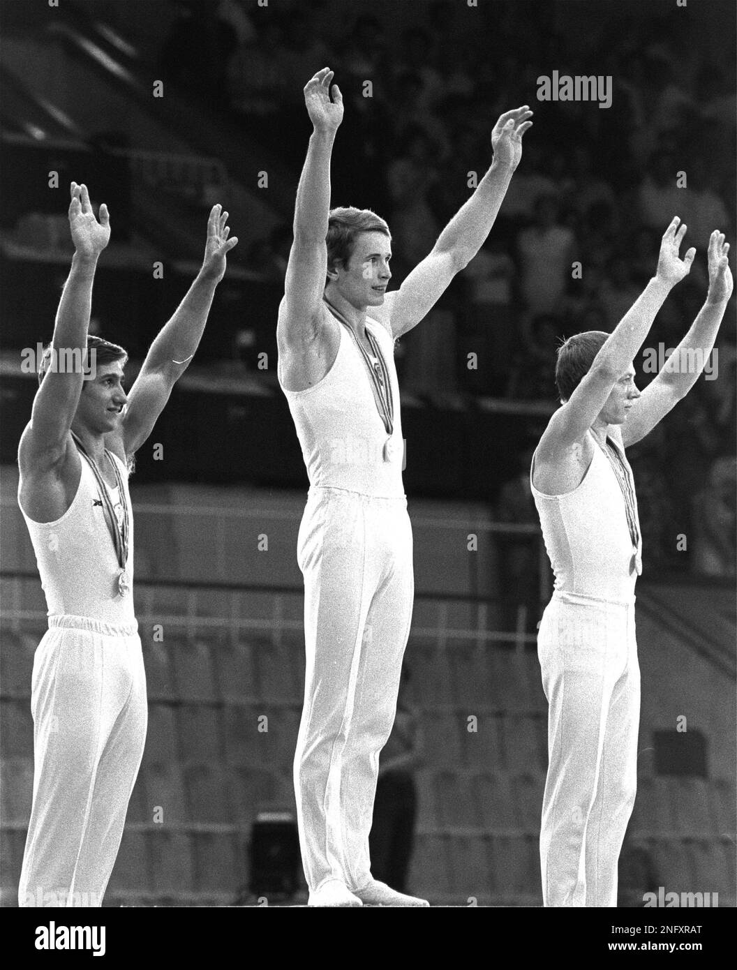 Soviet world champion gymnast Alexandr Dityatin, center, waves during ...