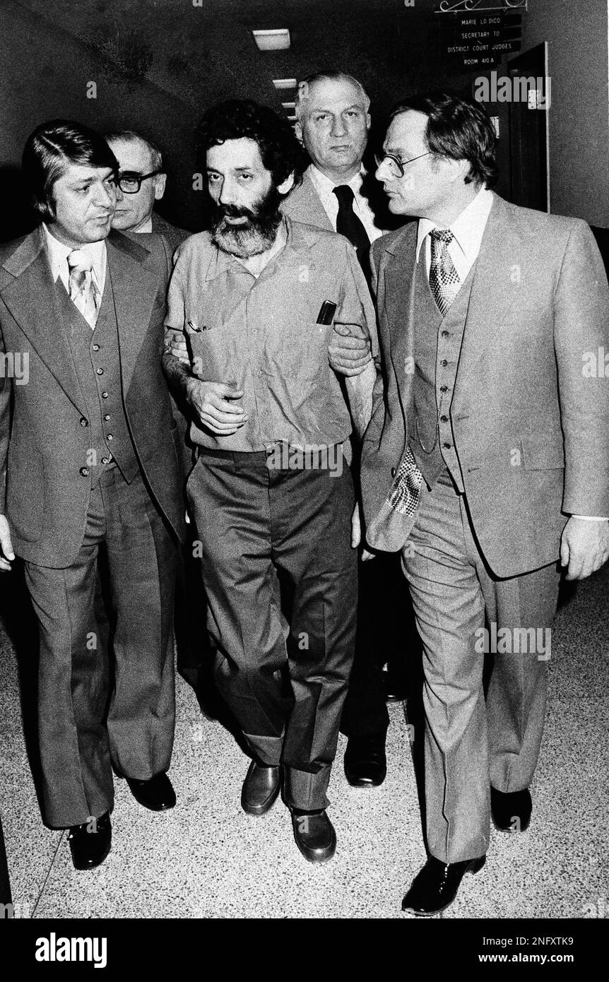 Accused murderer Joseph Kallinger, center, is escorted in the corridor ...