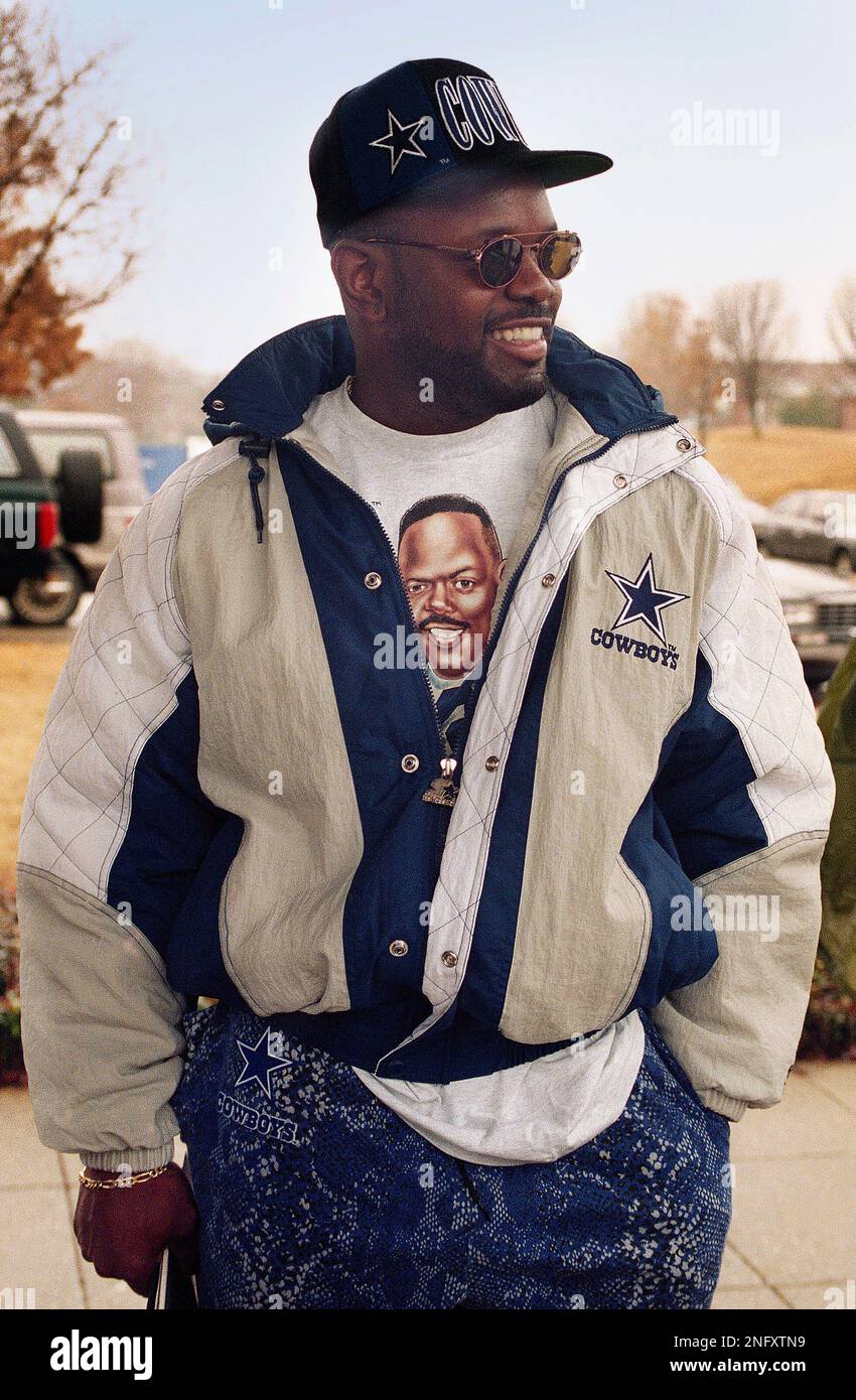 A smiling Emmitt Smith arrives at the Dallas Cowboy training facilty in ...