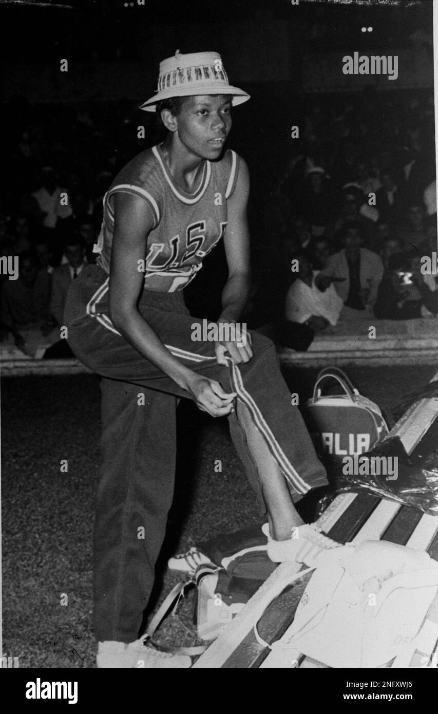 Wilma "Skeeter" Rudolph, 20, of Clarksville, Tenn., puts on her track ...