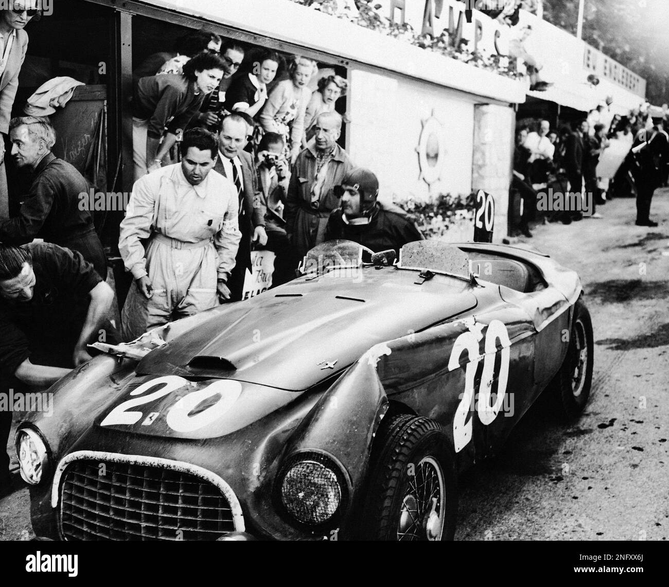 Luigi Chinetti of Italy sits at the wheel of his Ferrari while ...