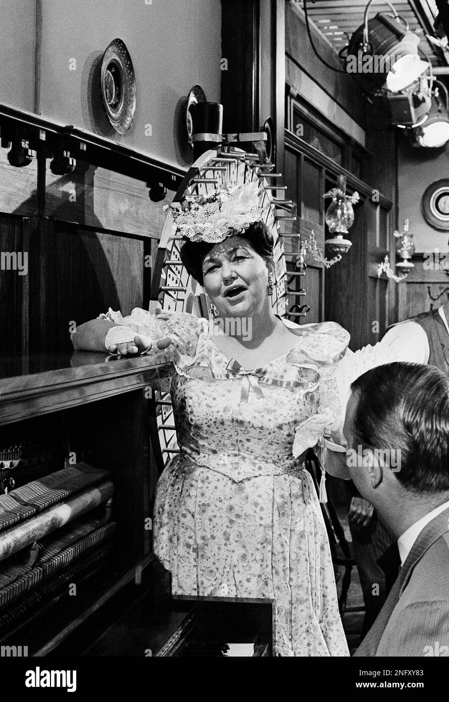 Mrs. Elva Miller, whose tremulous soprano defies description, isn't ...