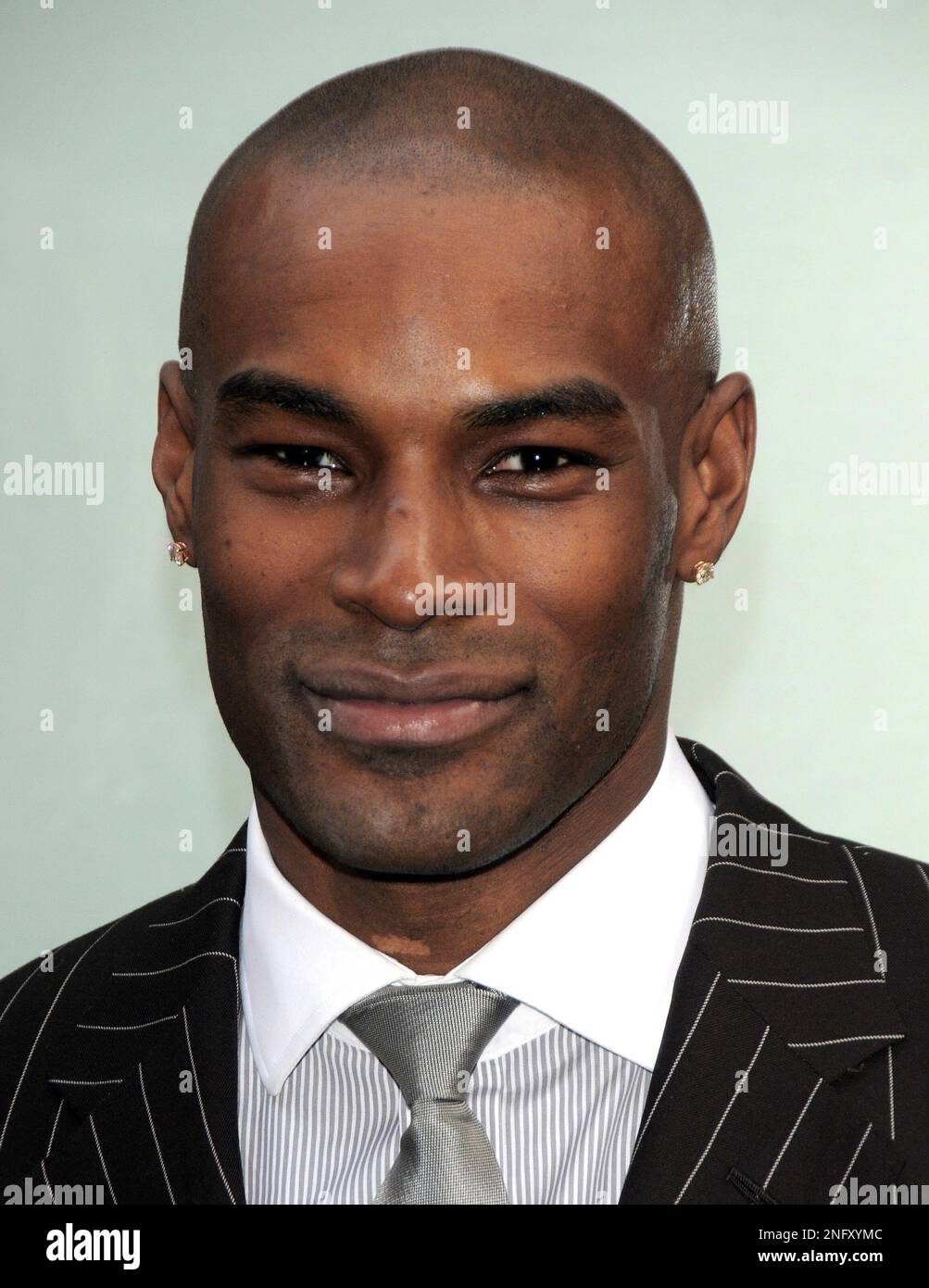 Model Tyson Beckford poses outside the NBC Experience store in ...