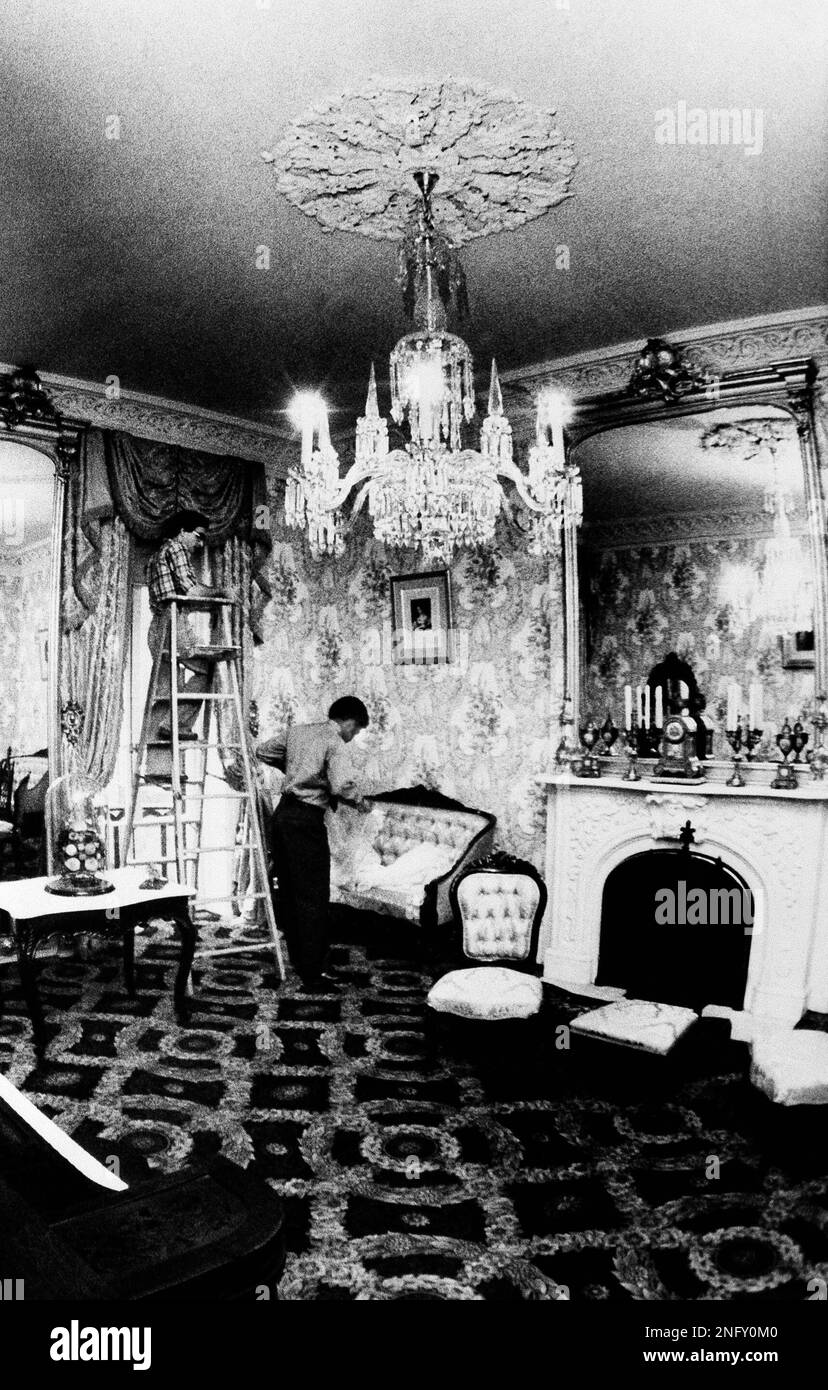 David Kahn, on ladder, curator of the Theodore Roosevelt townhouse, and ...
