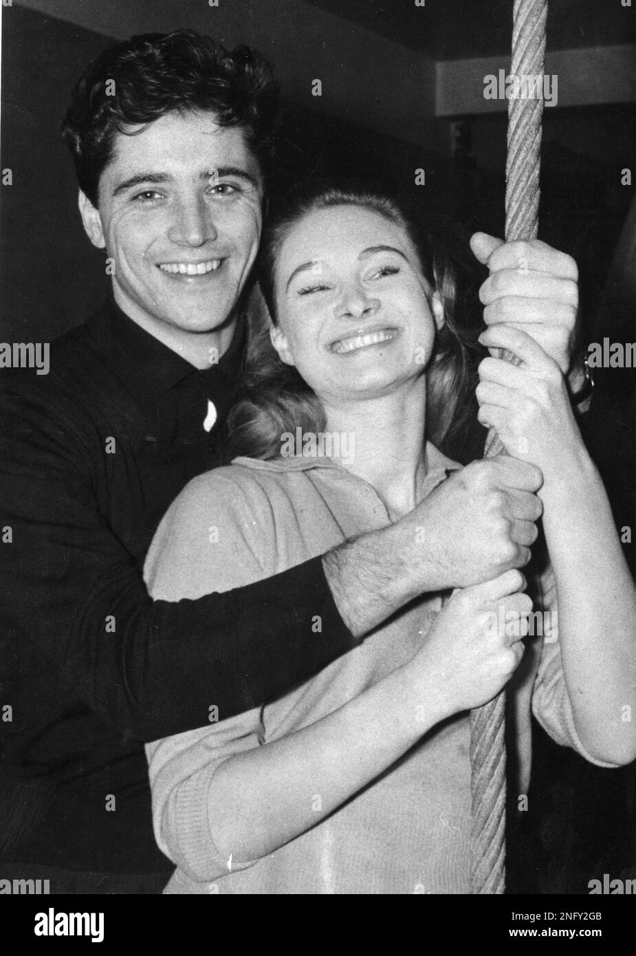 French singer Sacha Distel, left, holds a rope with French actress ...