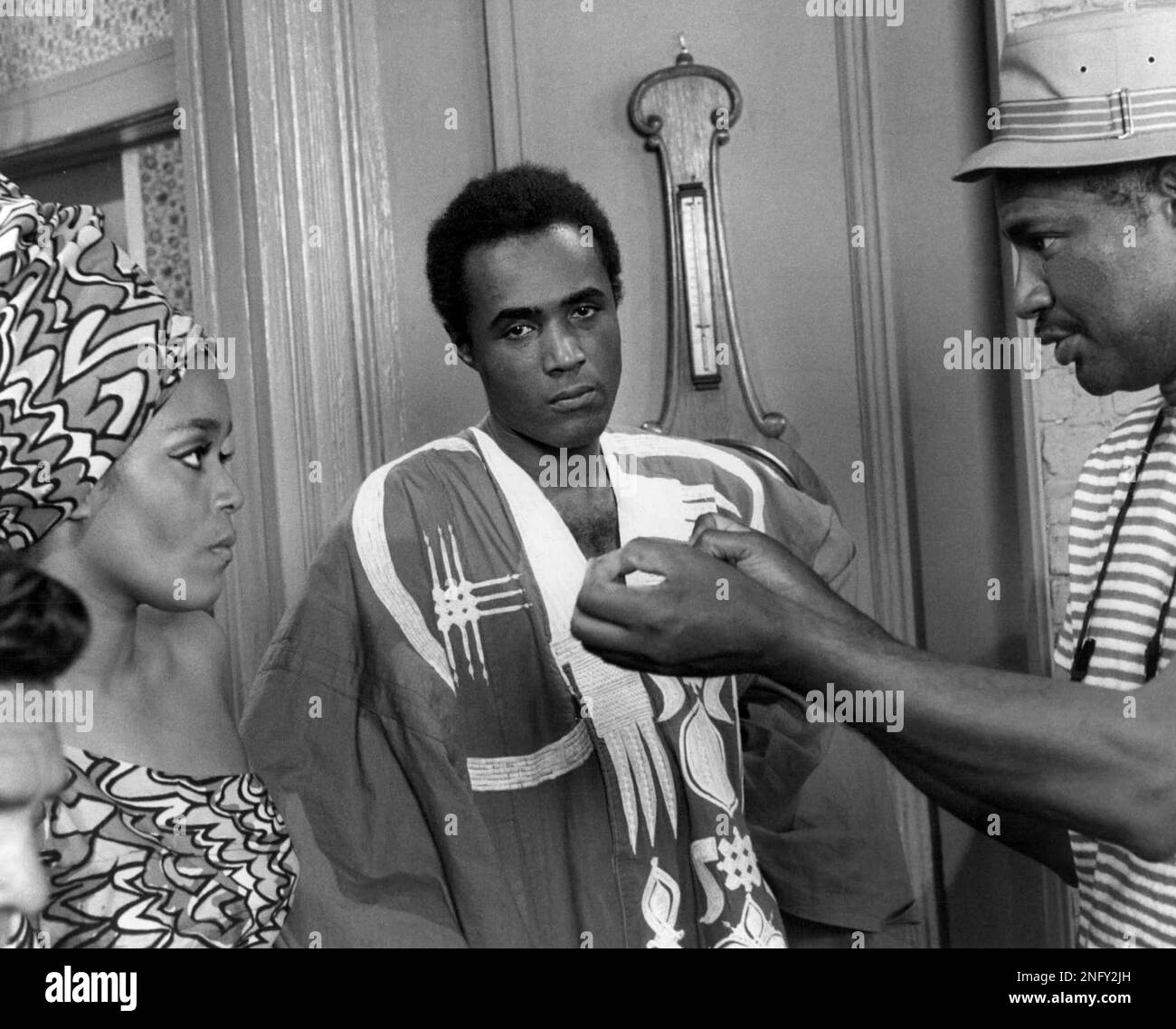 Director Ossie Davis talks to actors Emily Yancy, left, and Calvin ...