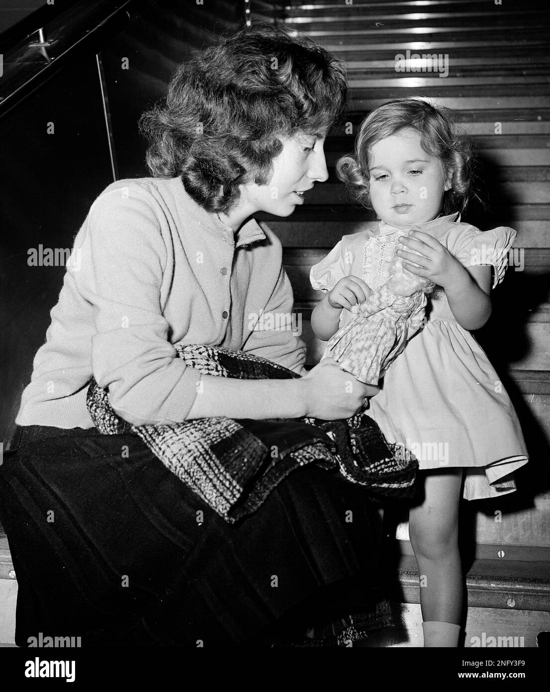 Becky Weger, 3, daughter of accused slayer Chester O. Weger, shows her ...