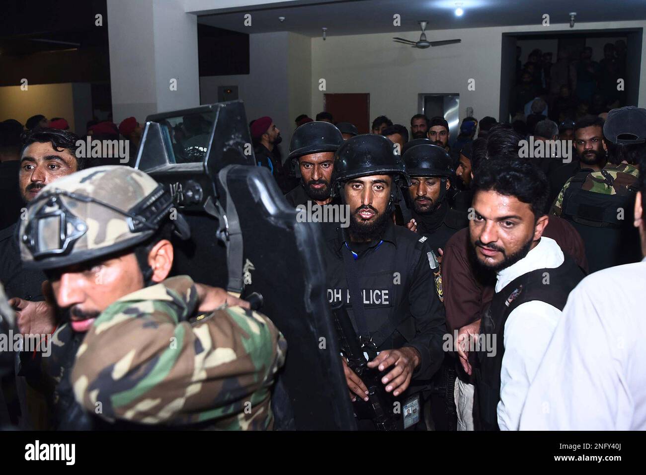 Paramilitary soldiers and police officers leave after conducting ...