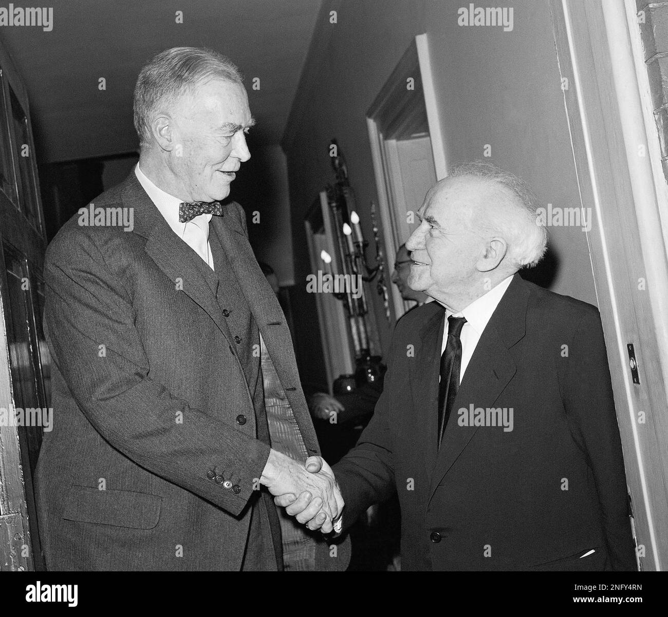 Secretary of State Christian Herter shakes hands with Prime Minister ...