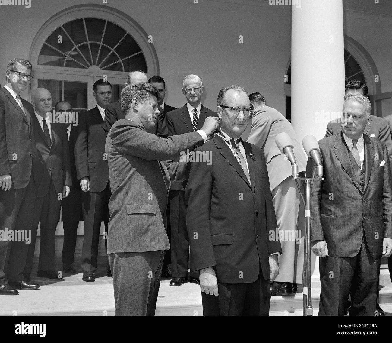 President John Kennedy decorates Fred L. Whipple with the 1963 ...