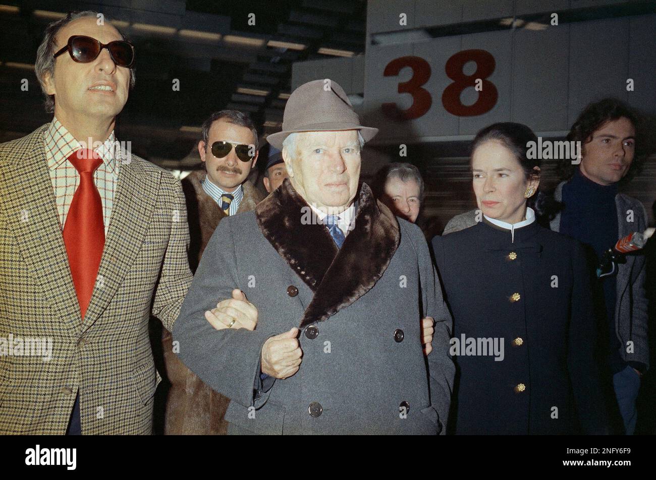 Charlie Chaplin, center, arriving at Orly Airport in Paris with his ...