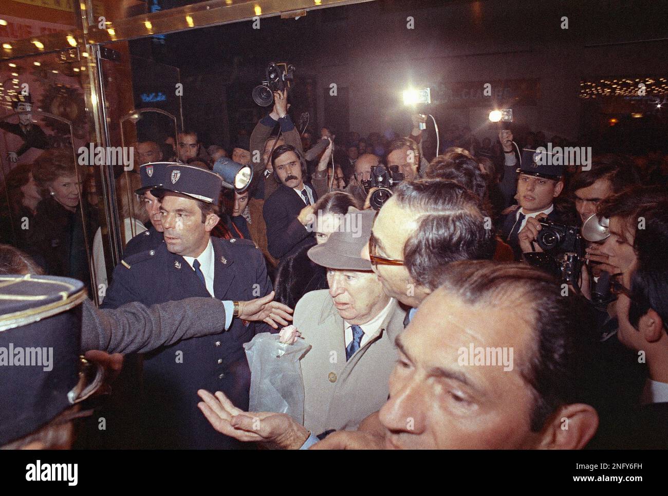 Charlie Chaplin, in hat, arriving at Orly Airport in Paris with his ...