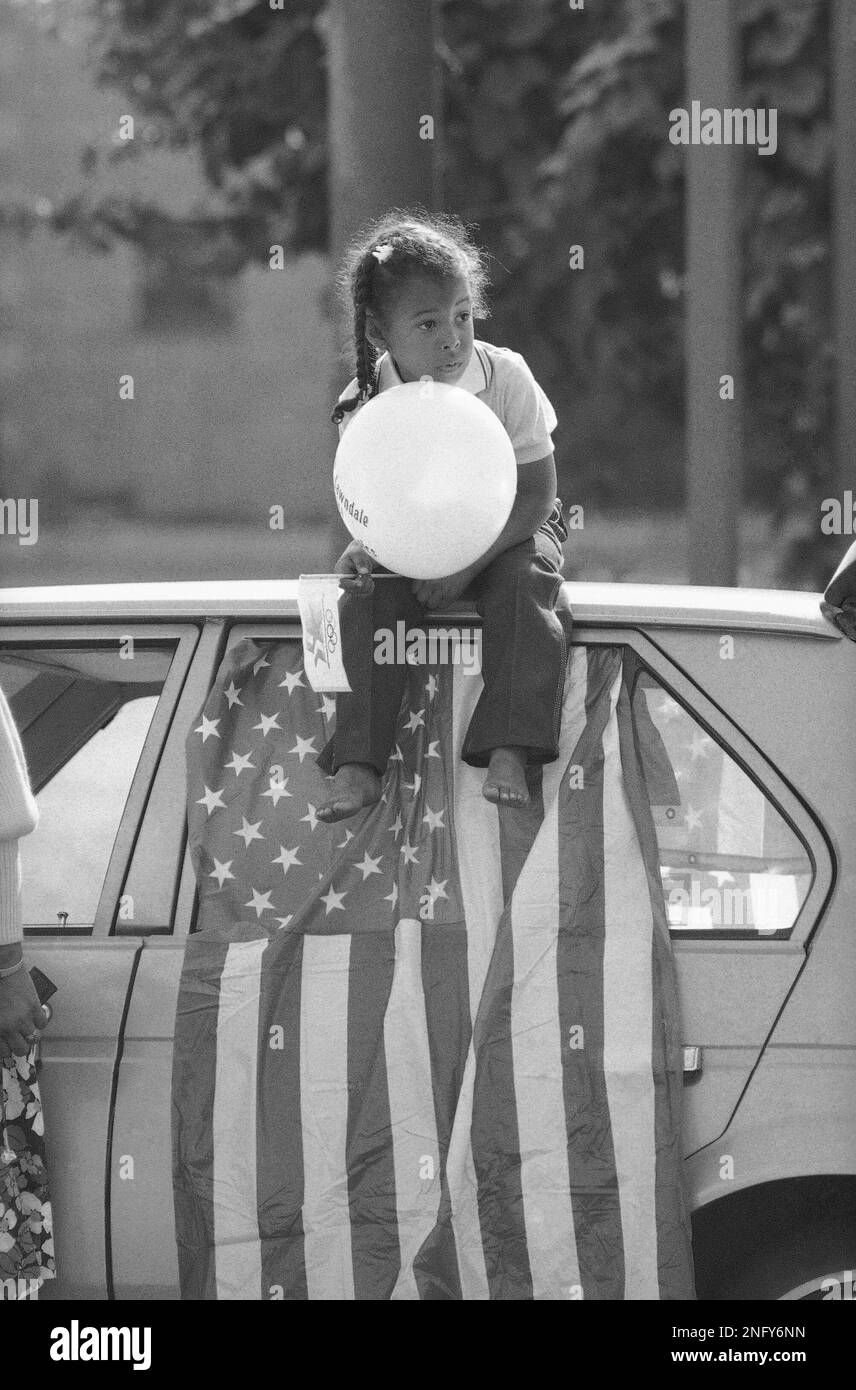 Raynelle Gipson, 4, from Ingelwood, Calif., watches the Olympic torch ...