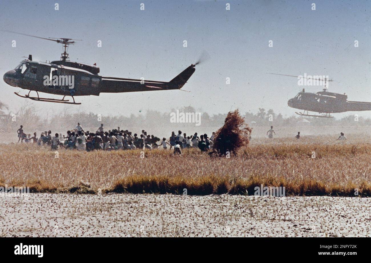 Seen here is the first of the U.S. Aid helicopters as they drop sacks ...
