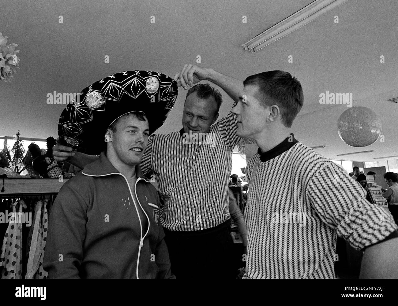 Two teammates boxer Bjarne Limgaas and Nils Romme, right, admire ...