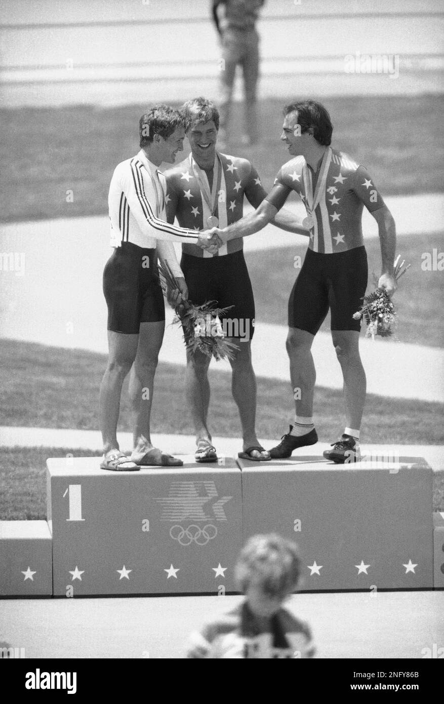 As American Cyclist Steve Hegg looks on, America's bronze medalist ...
