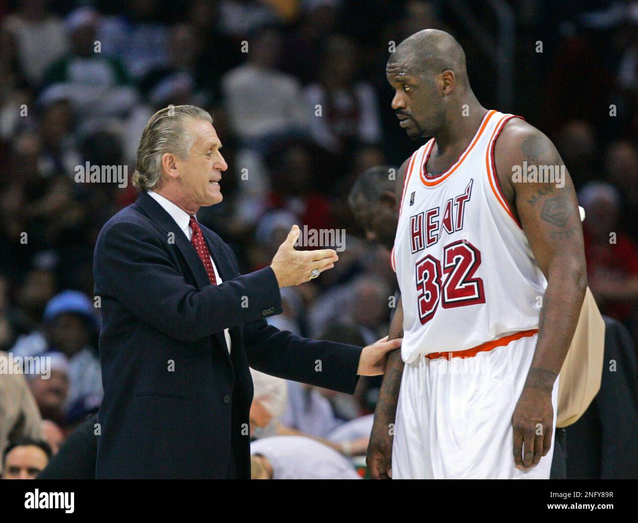 Miami Heat coach Pat Riley, left, talks to center Shaquille O'Neal (32 ...