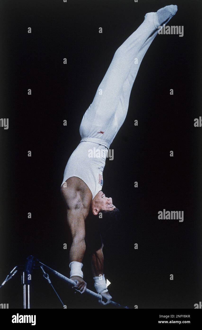 Tim Daggett of West Springfield, Mass., performs on the horizontal bar ...