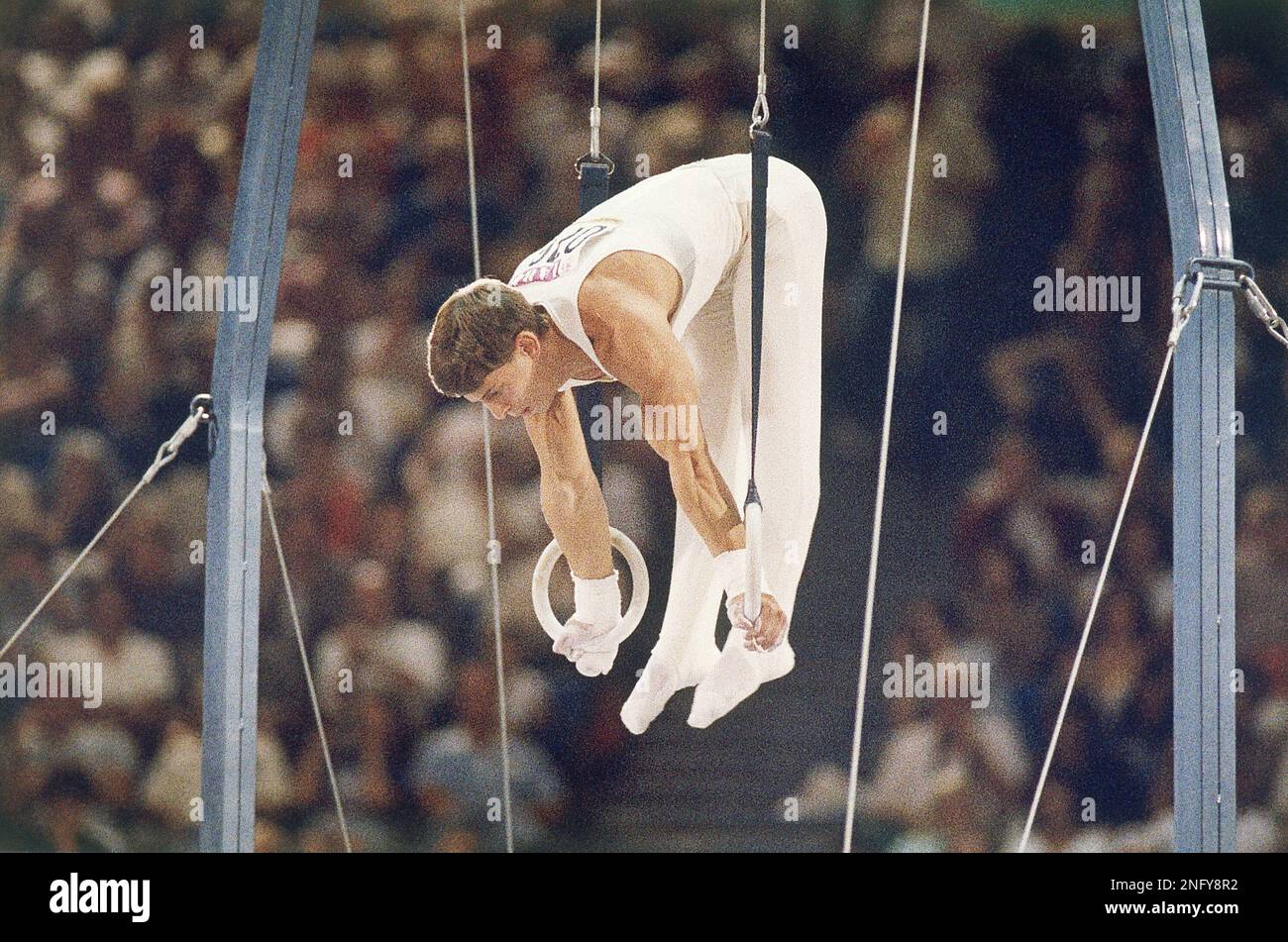 Tim Daggett of West Springfield, Mass., performs on the rings during ...