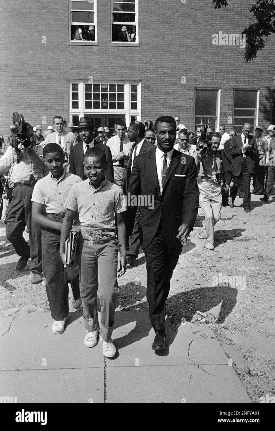 Rev. Fred Shuttlesworth right, integration leader, escorts Dwight ...