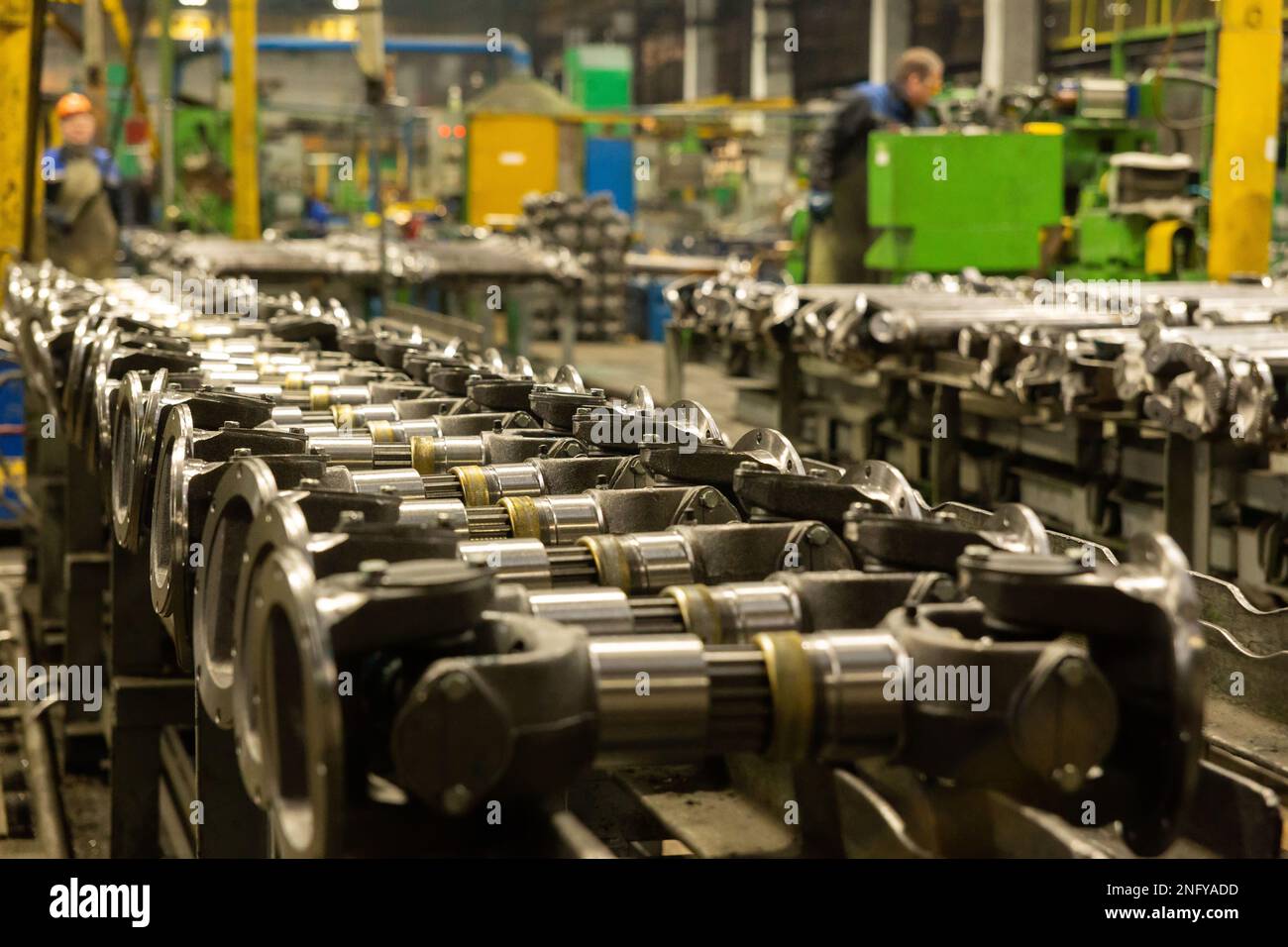 Cardan shafts and gimbal transmissions moving on conveyor during ...