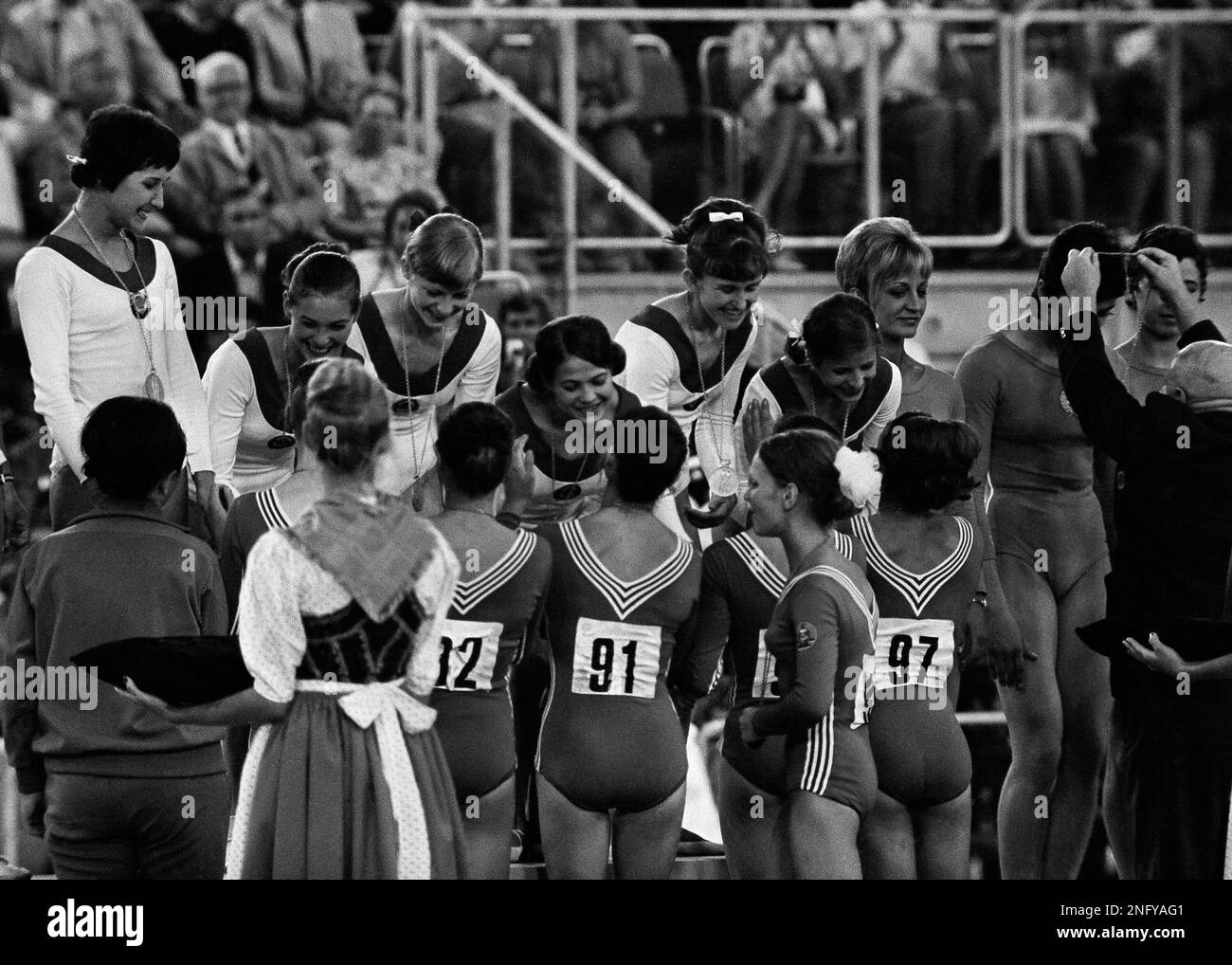 The members of the Soviet women's gymnastic team stand at attention ...