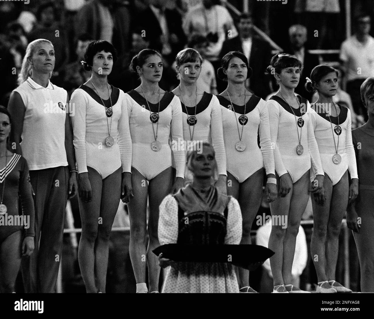 The members of the Soviet women's gymnastic team stand at attention ...