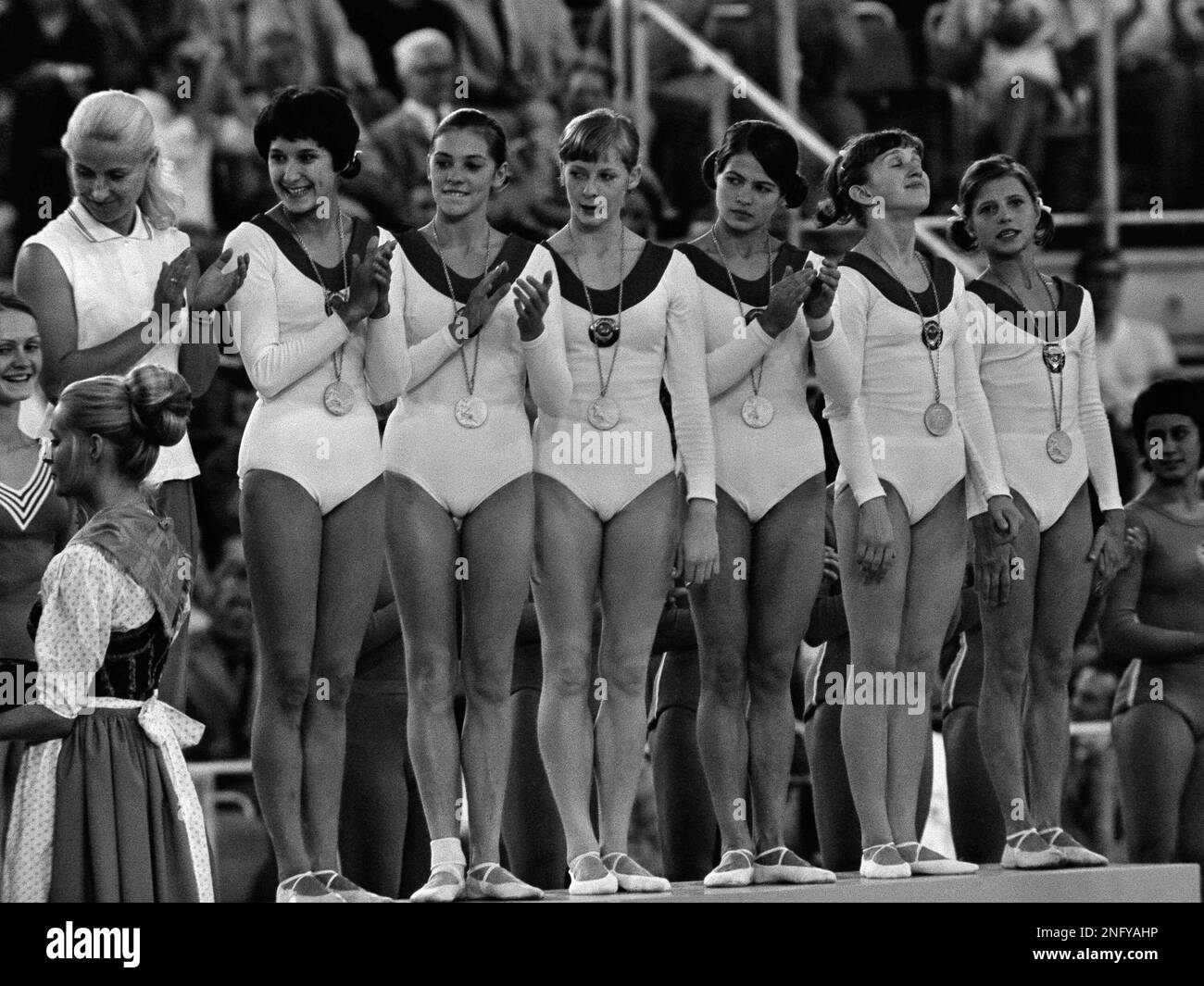 The members of the Soviet women's gymnastic team stand at attention ...