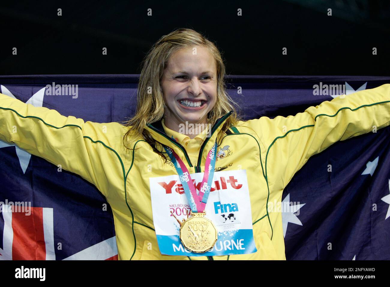 Gold medalist Australia's Libby Lenton holds Australian national flag ...