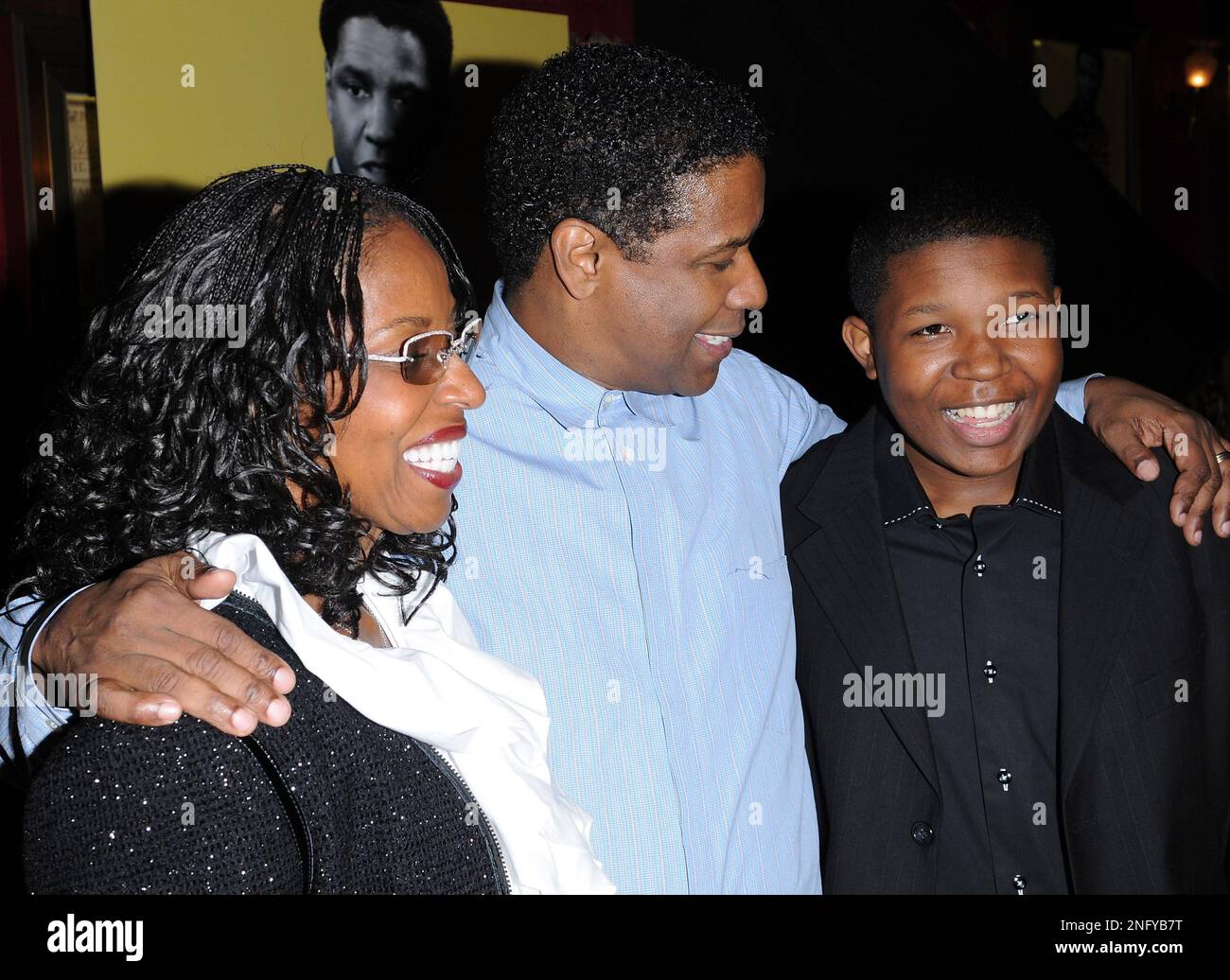 Director-actor Denzel Washington, center, and his wife Pauletta greet ...