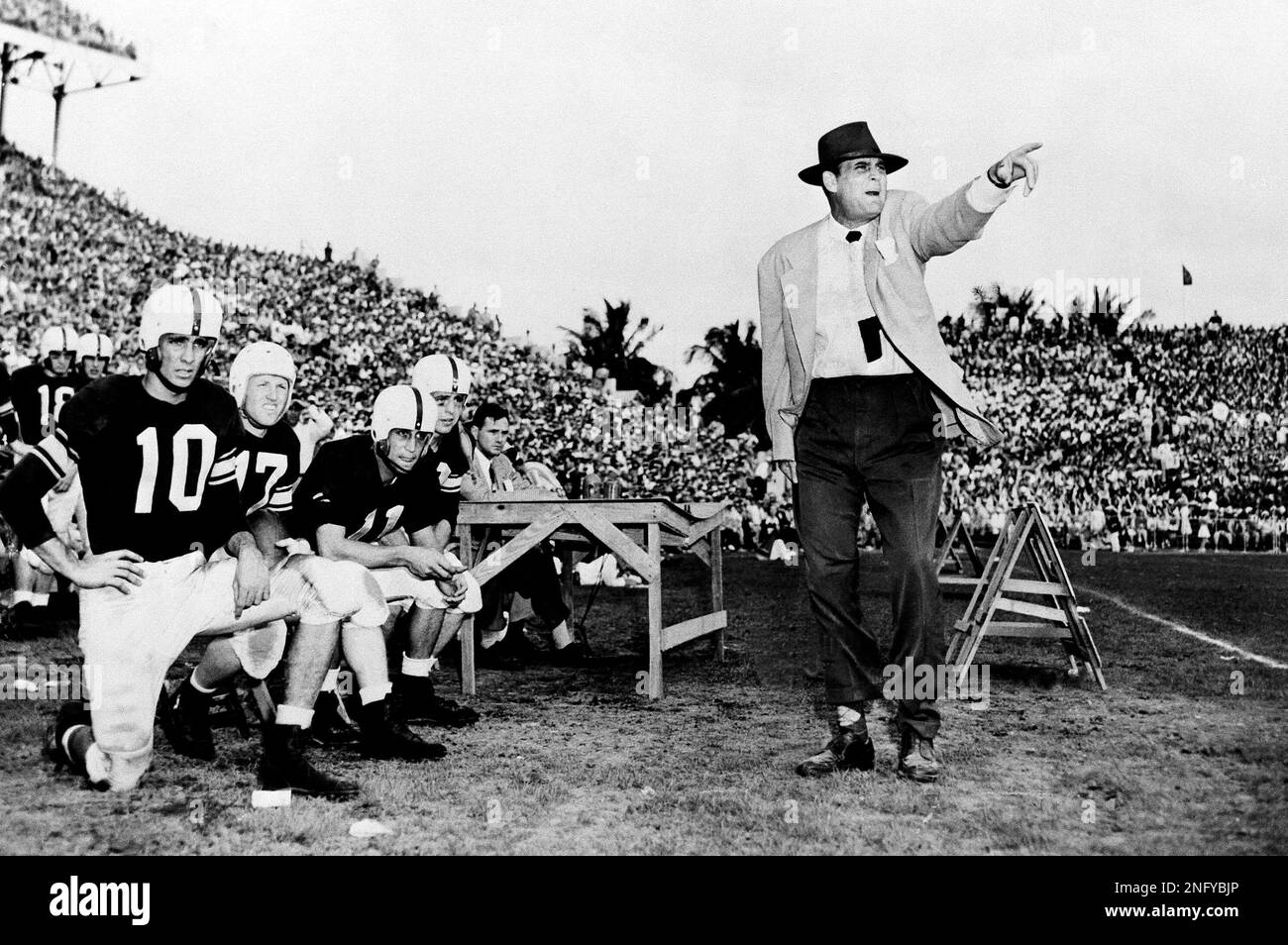 Paul "Bear"Bryant on the sidelines at a college football game in 1957 ...
