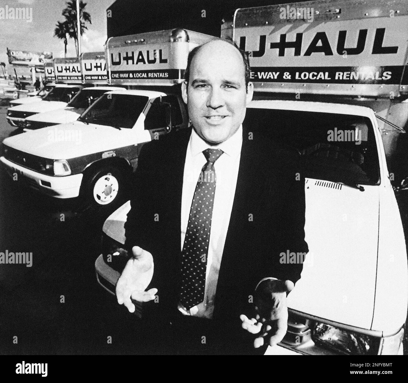 Edward "Joe" Shoen gestures, January 25, 1989 to a new line of Toyota ...