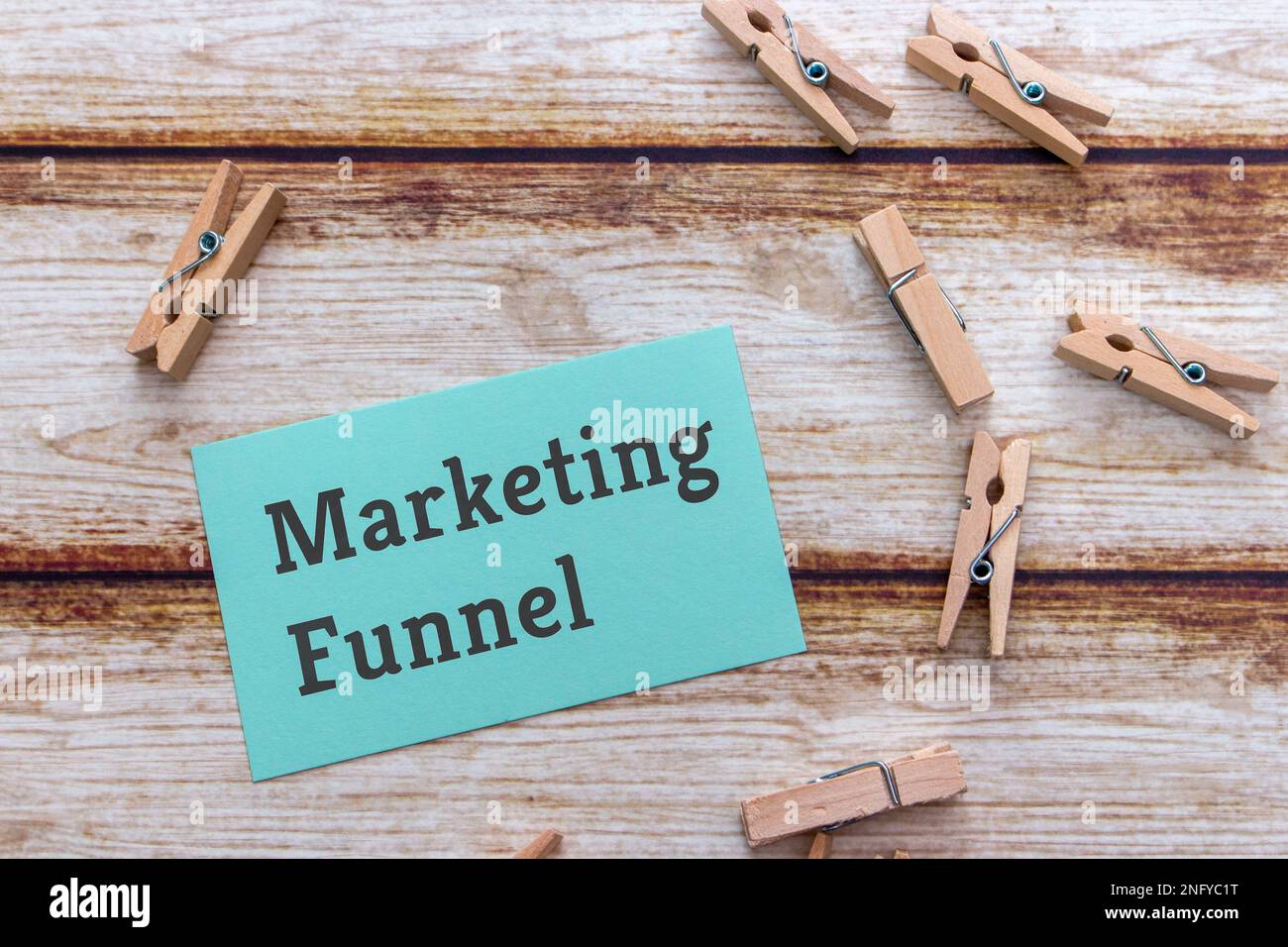 Message card showing Marketing Funnel with wooden pinch on shabby ...
