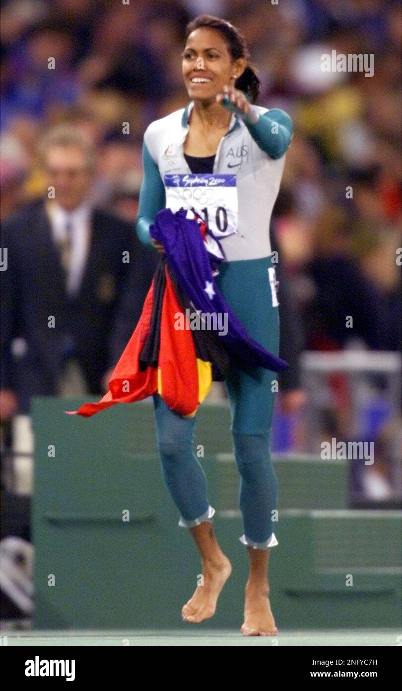 Australia's Cathy Freeman celebrates after winning the gold medal in ...