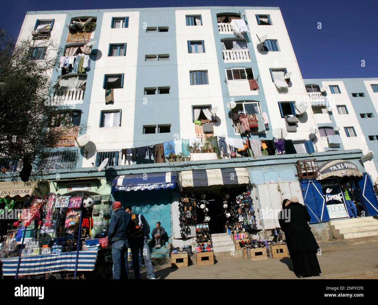 Resident in a street of Bourouba, just outside Algiers, Saturday Dec.15 ...