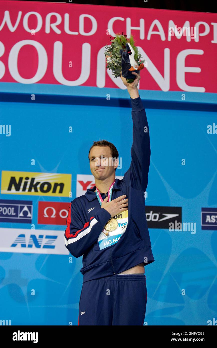 Aaron Peirsol of the USA holds his hand across his chest after winning ...