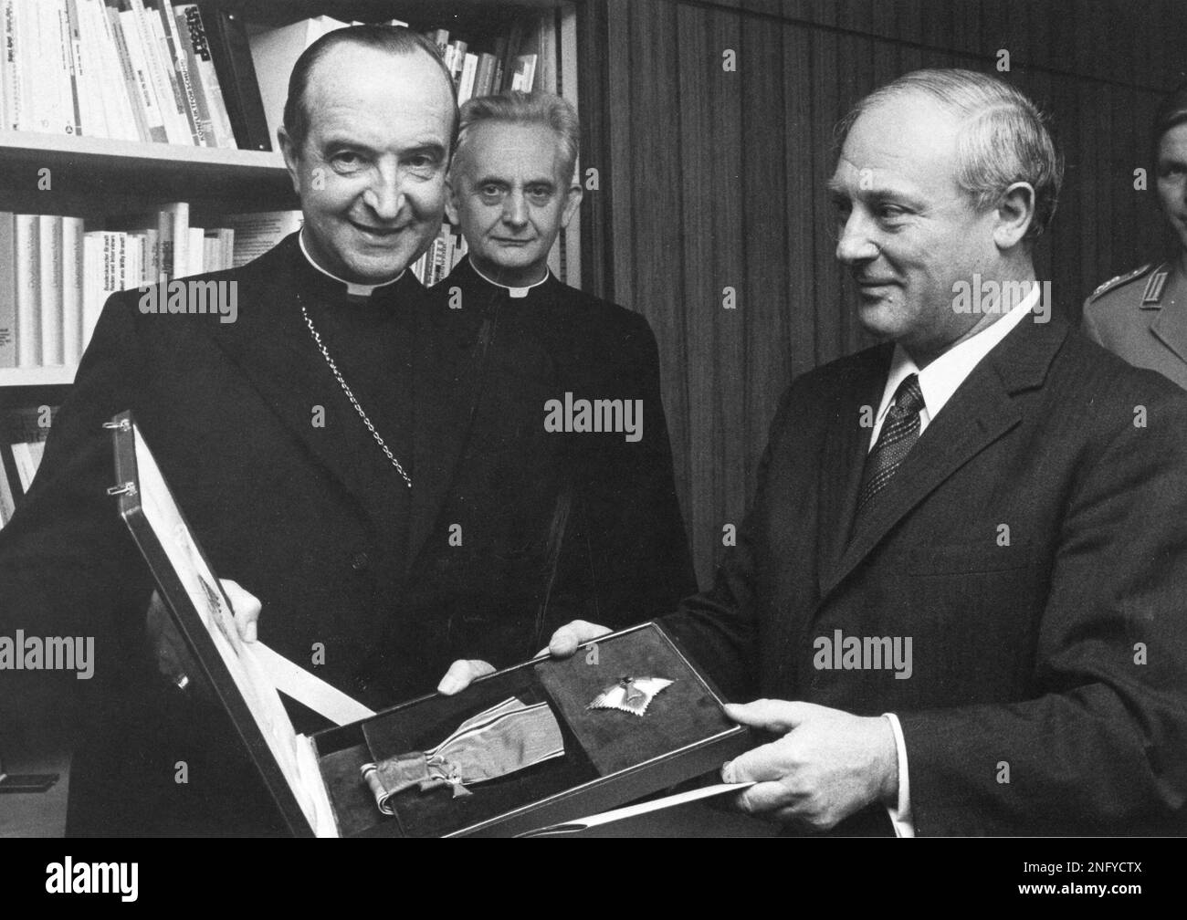 West German minister of defence, Georg Leber, right, hands over the ...