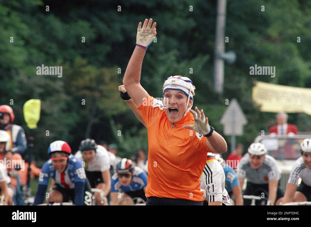 Monique Knol of the Netherlands raises her arms in triumph after ...
