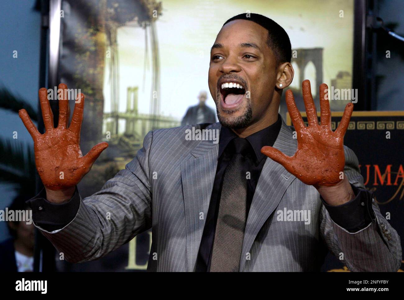 Actor Will Smith, star of "I Am Legend," shows his hands after placing ...