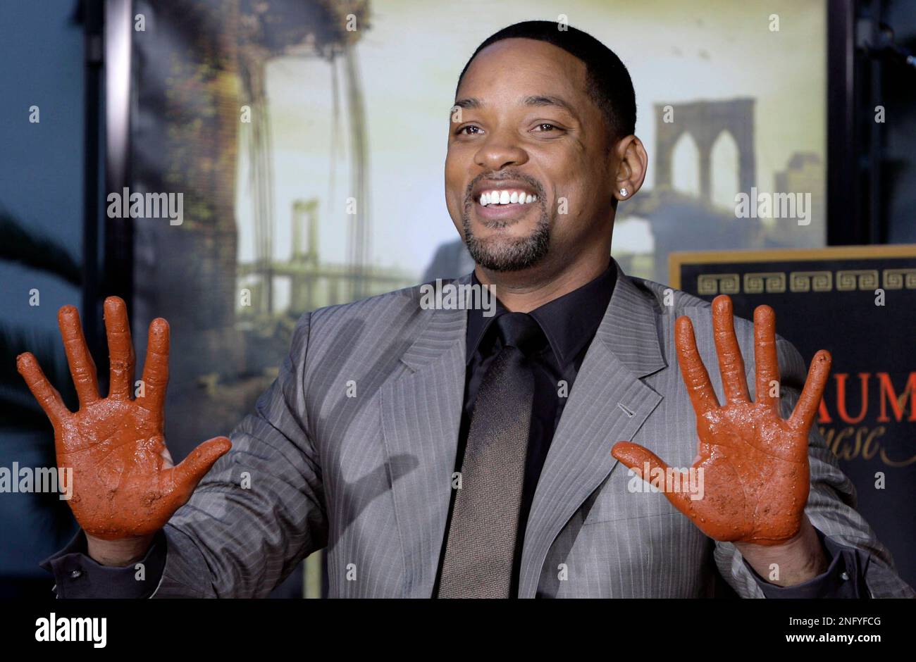 Actor Will Smith, star of "I Am Legend," shows his hands after placing ...