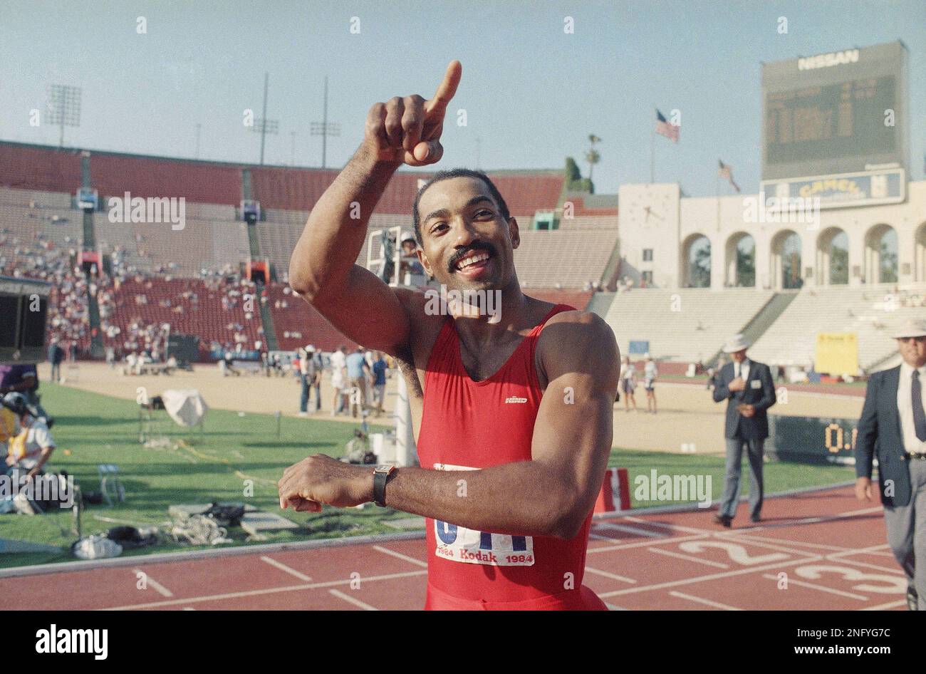 American track and field athlete Greg Foster scene gesturing, 1984 ...