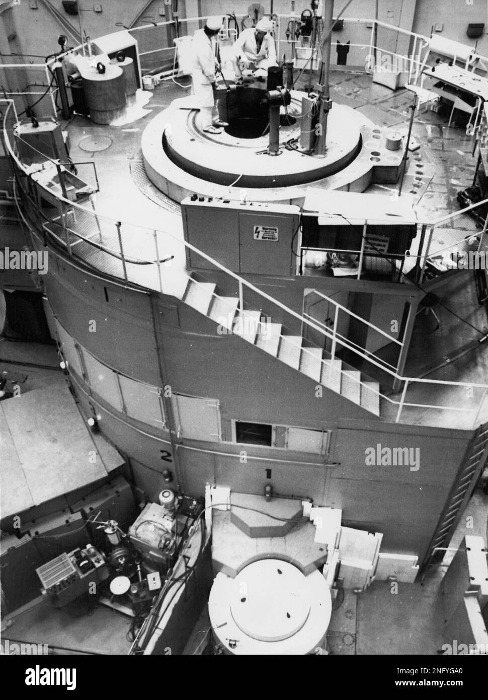 Undated image from the 1950's shows two people working at the reactor ...