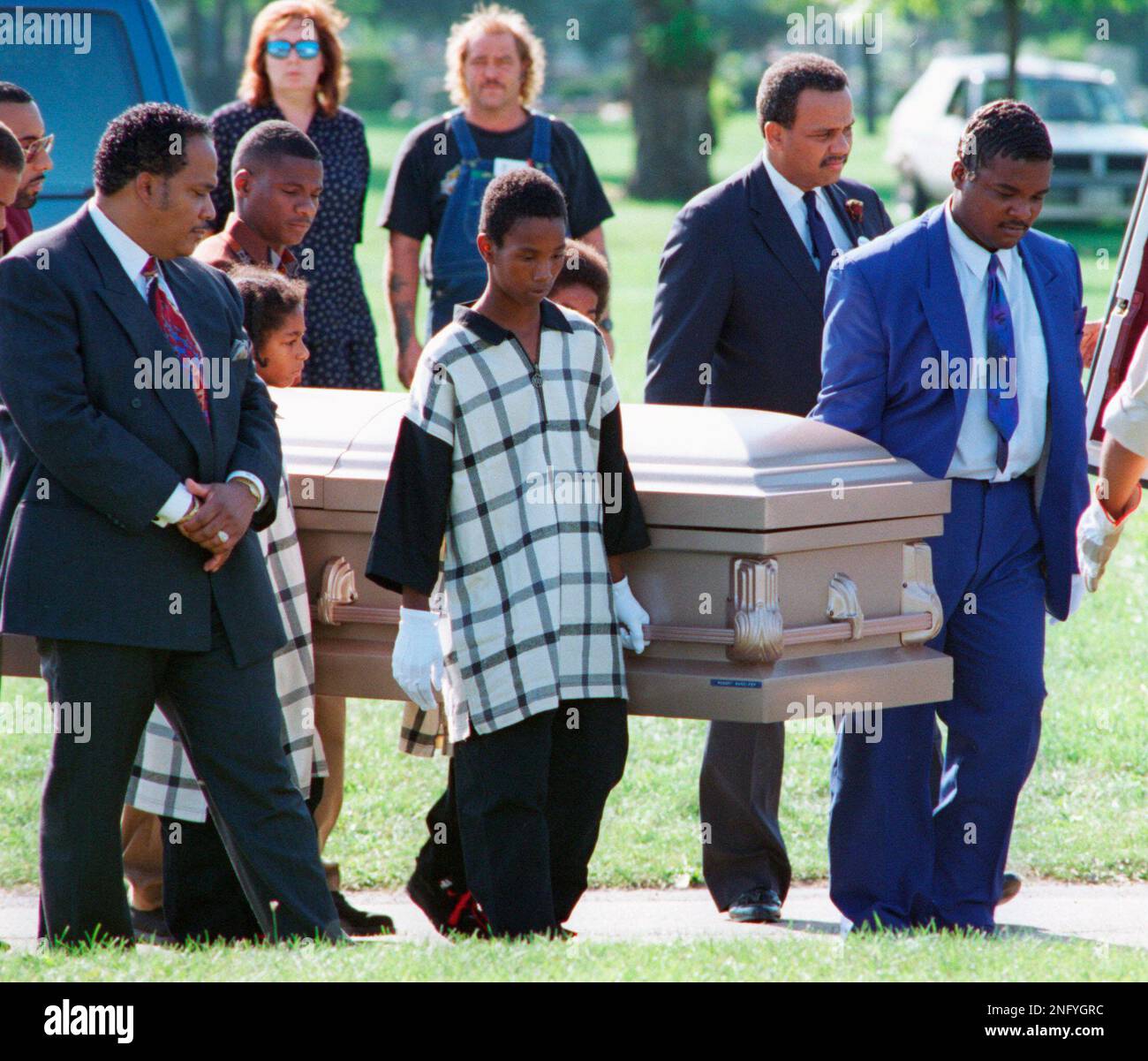 **ADVANCE FOR TUESDAY, DEC. 18** **FILE** Pallbearers carry the coffin ...