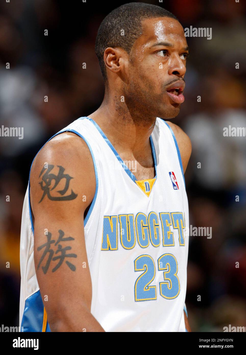 Denver Nuggets forward Marcus Camby looks on against the Los Angeles ...